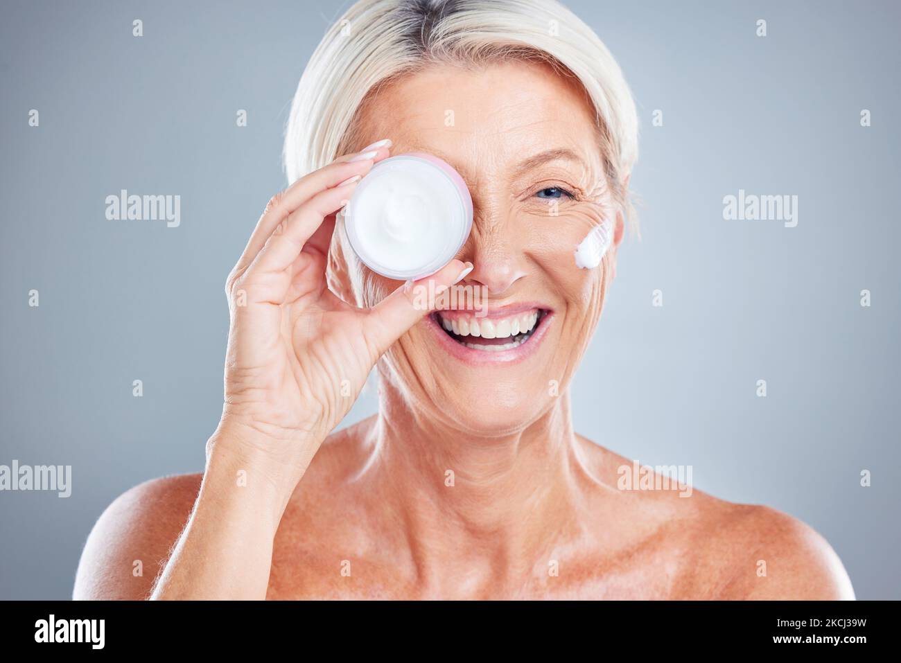 Beauty, skincare and senior woman with face cream for moisturizing on a ...