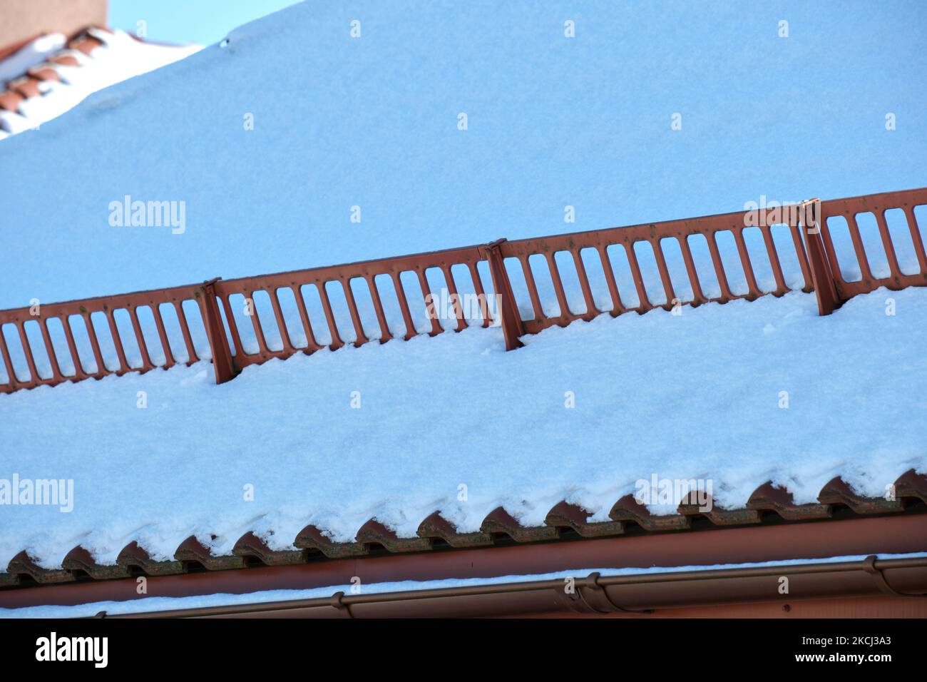 Snow guard for safety in winter on house roof top covered with steel ...