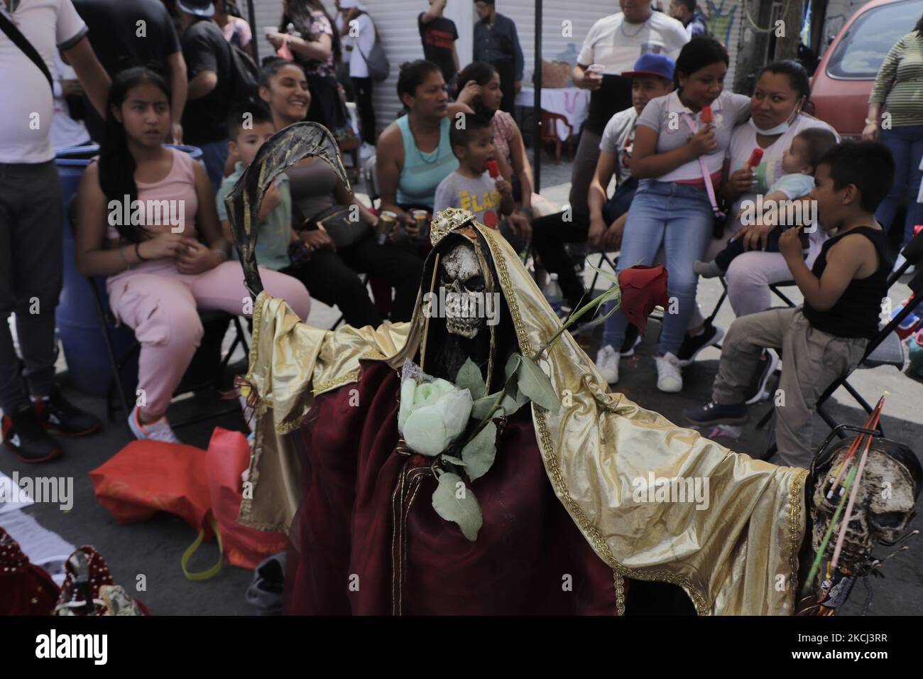 A group of people outside the temple of Santa Muerte, located in Tepito ...