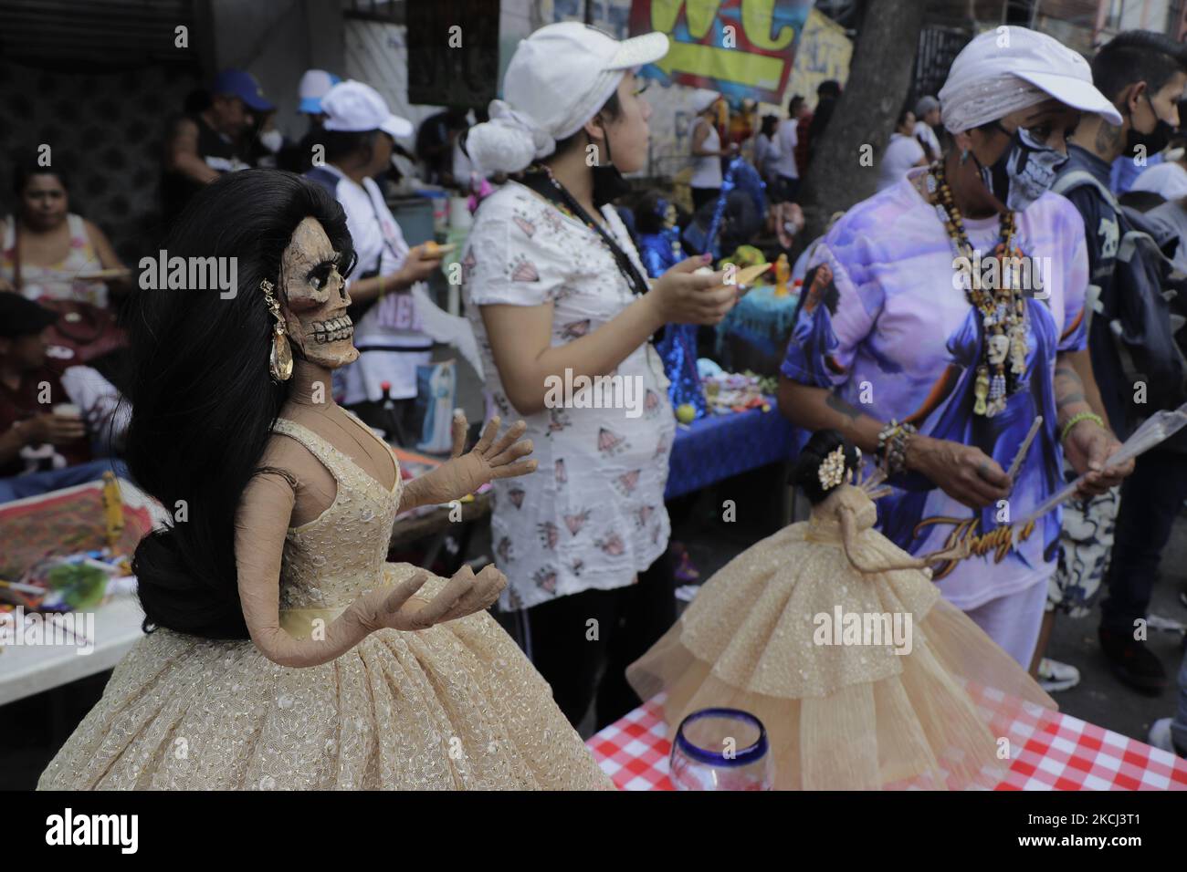 A group of people outside the temple of Santa Muerte, located in Tepito ...