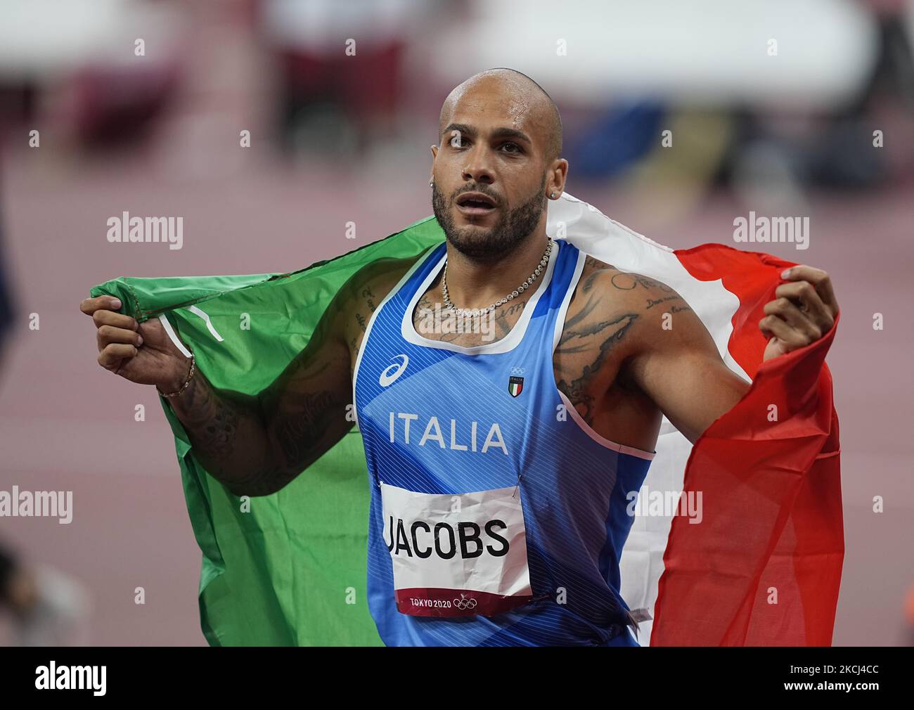Lamont Marcell Jacobs winning gold at 100 meter at the Tokyo Olympics ...