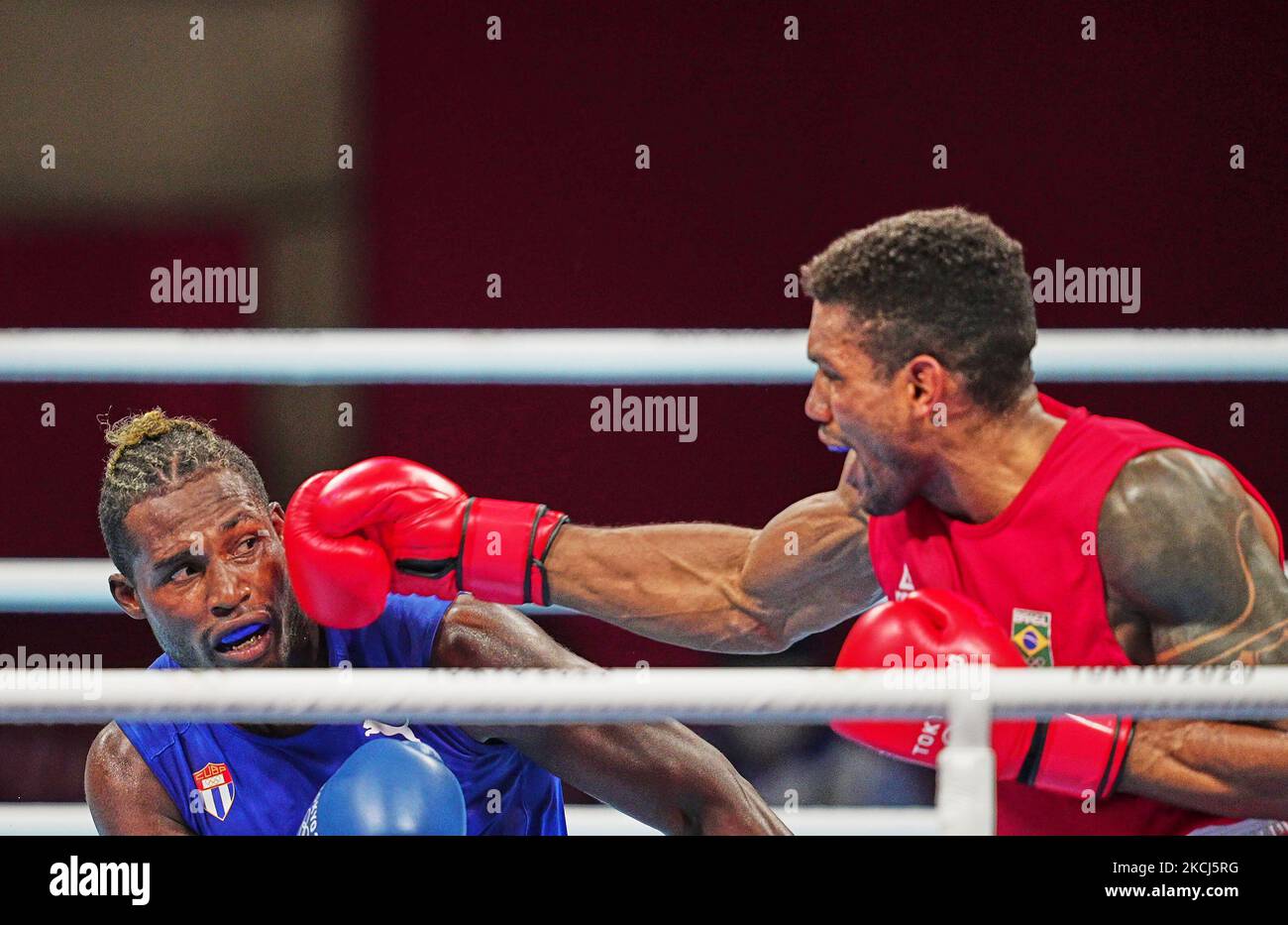 Julio La Cruz from Cuba and Abner Teixeira from Brazil during boxing at the Tokyo Olympics at ...