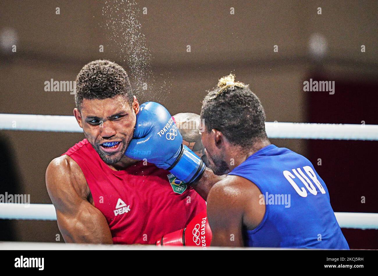 Julio La Cruz from Cuba and Abner Teixeira from Brazil during boxing at the Tokyo Olympics at ...
