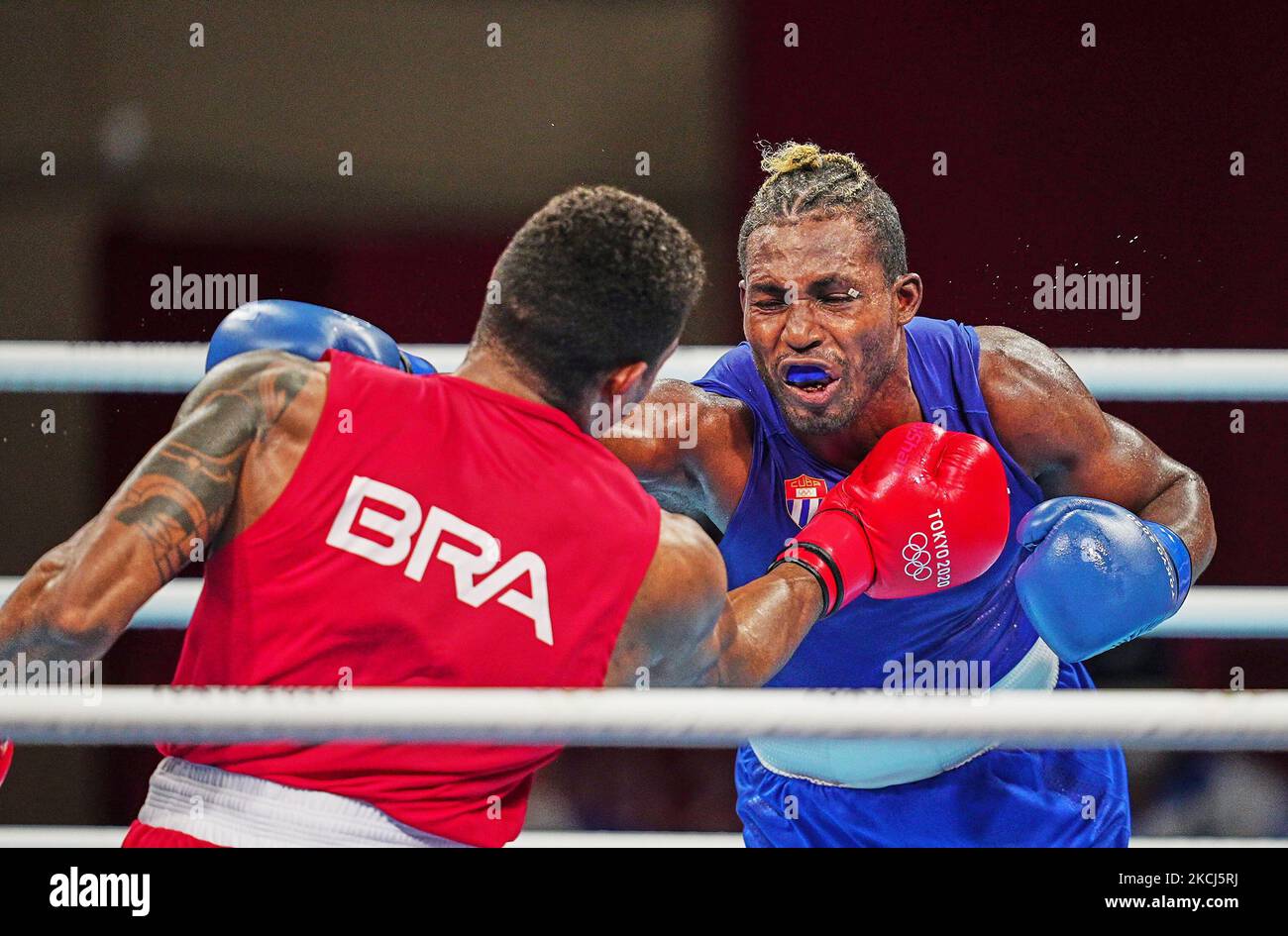 Julio La Cruz from Cuba and Abner Teixeira from Brazil during boxing at the Tokyo Olympics at ...
