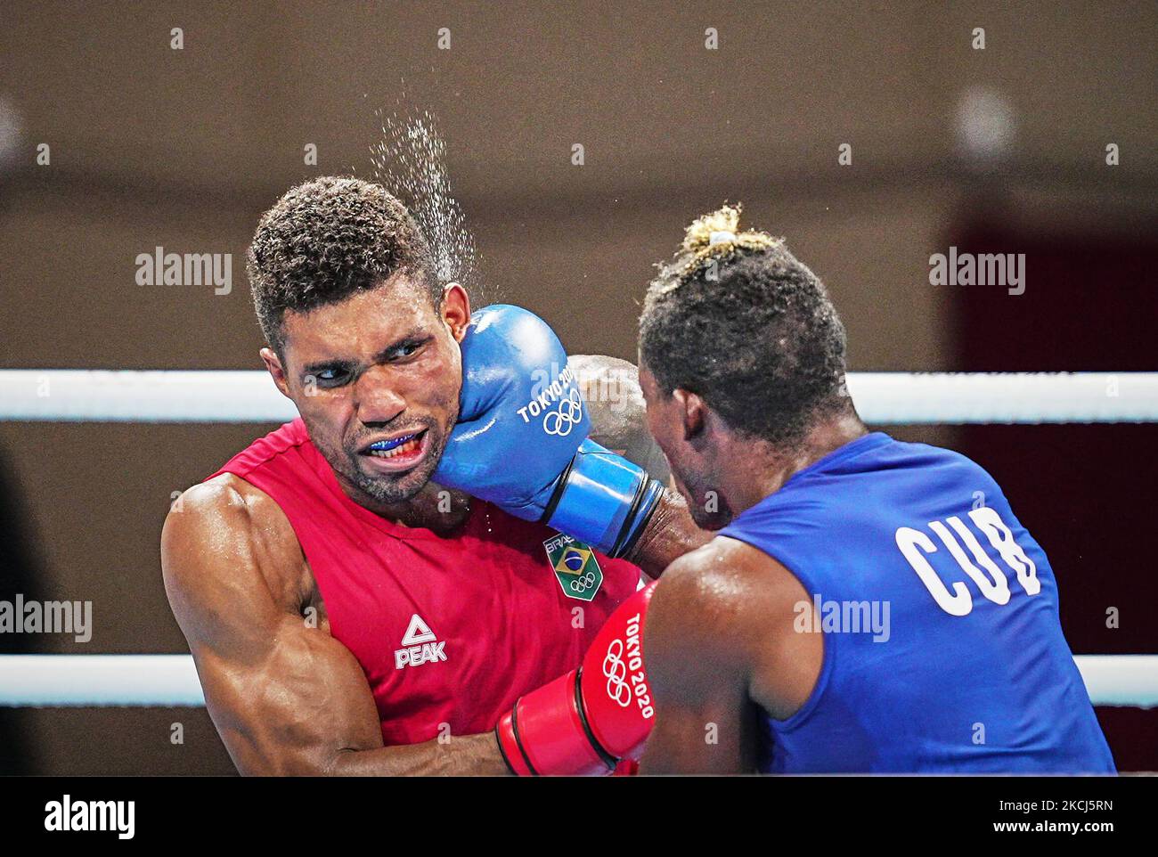 Julio La Cruz from Cuba and Abner Teixeira from Brazil during boxing at the Tokyo Olympics at ...