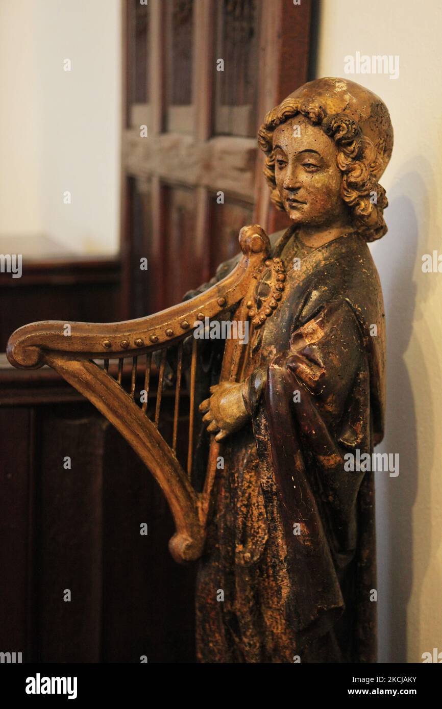 Colonial harp player figure in the music room in the Alcazar de Colon ...