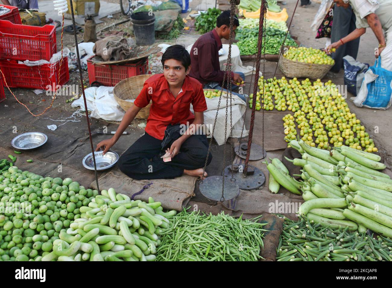 Boy selling vegetables at the Shaniwaar Subzi Bazaar, which is the ...