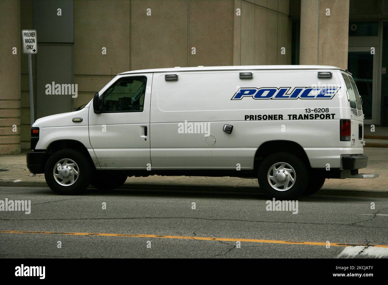 Police prisoner transport van parked outside a courthouse in downtown ...