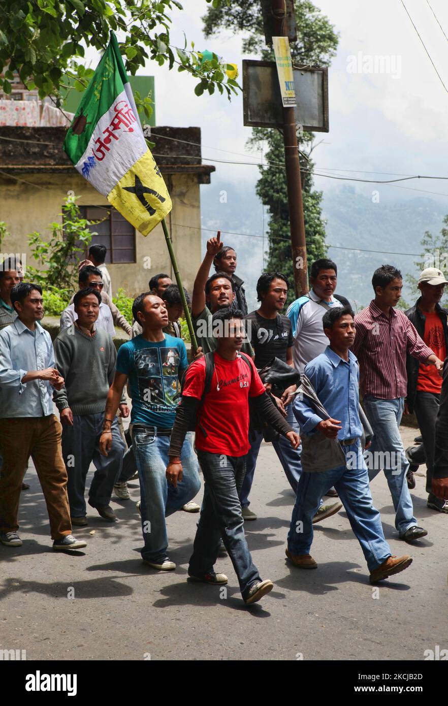 Youth carry a Gorkhaland flag during a huge political rally as ...