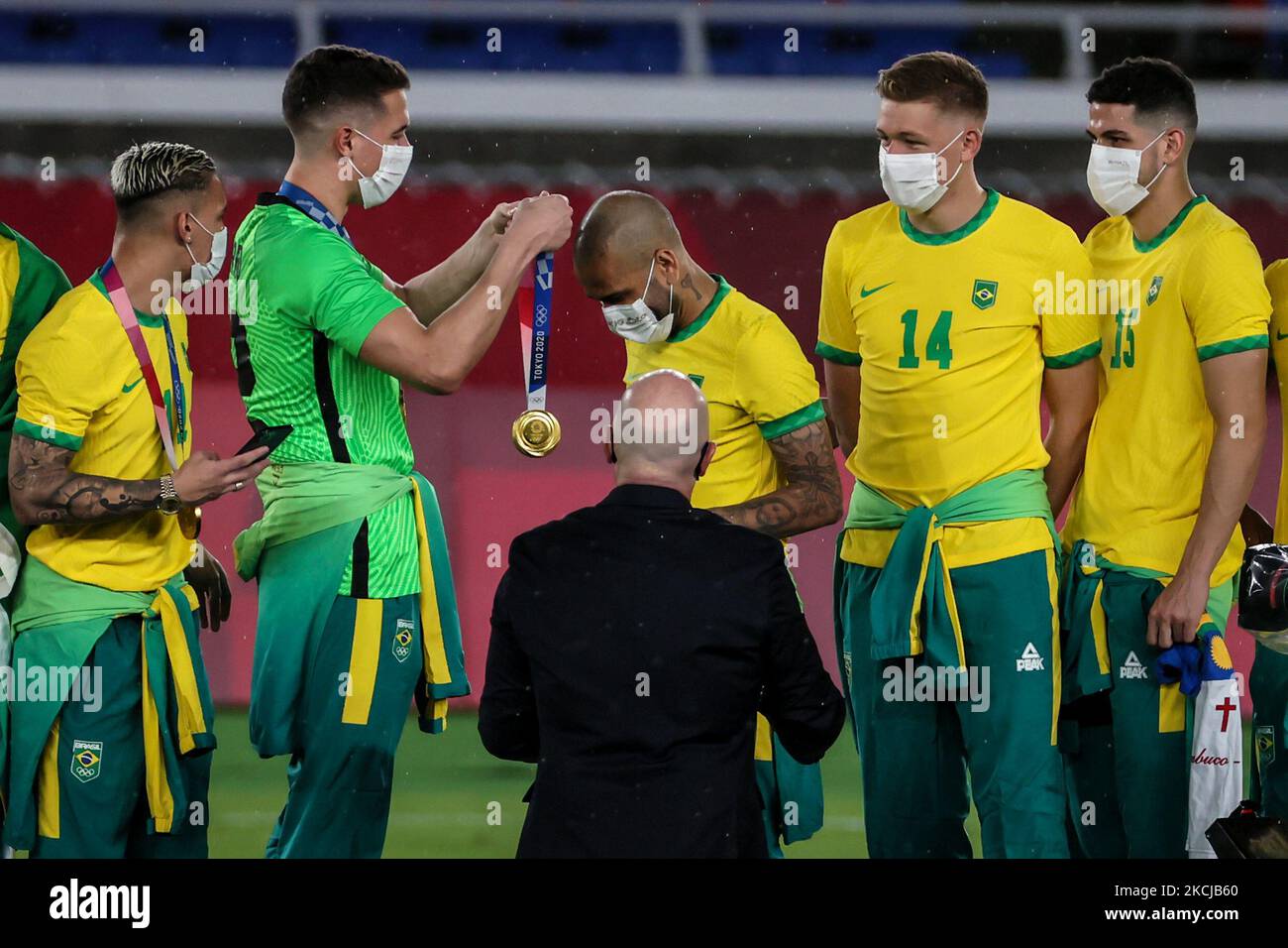 Gold medalists (13) Dani Alves of Team Brazil pose with their gold ...