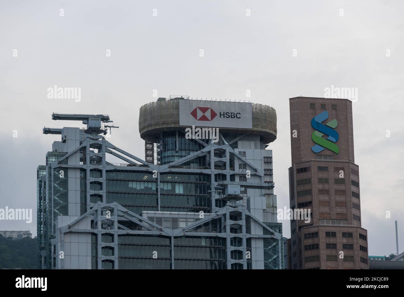 The buildings of HSBC and Standard Chartered Bank can be seen standing ...