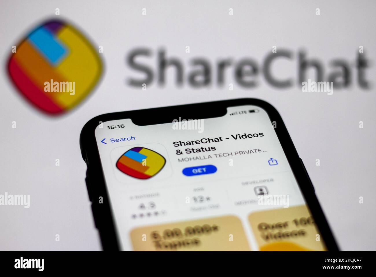 ShareChat logo on the App Store displayed on a phone screen and ...