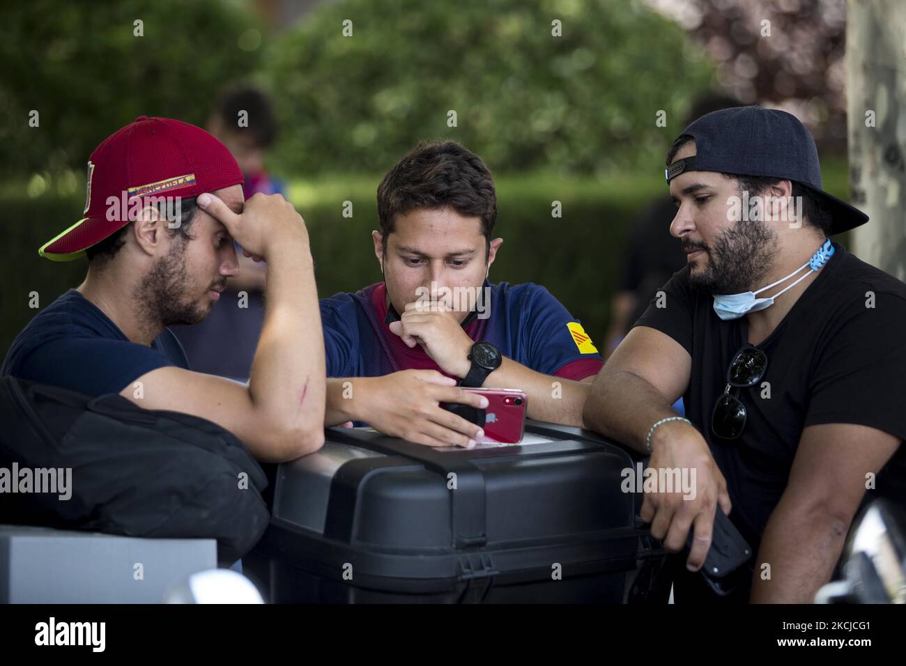 F.C. Barcelona fans gather out of the Barca stadium in Barcelona, Spain ...