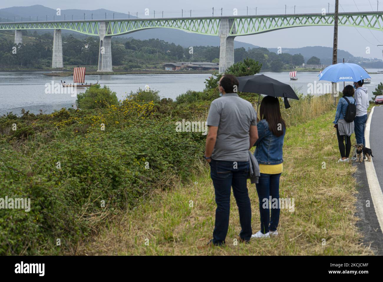 People watching the Viking Romeria at the Ulla river on August 01, 2021 ...