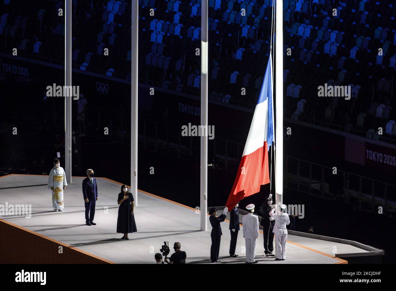Closing ceremony in the Olympic Stadium. The flags of Japan, Greece and ...