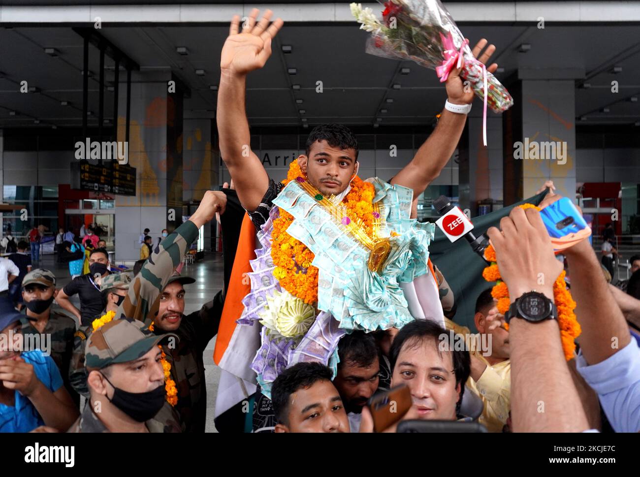 Indian wrestler Deepak Punia gestures as he gets a warm welcome by ...