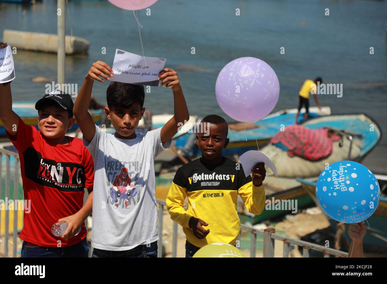 Palestinian children release balloons during a protest against the ...