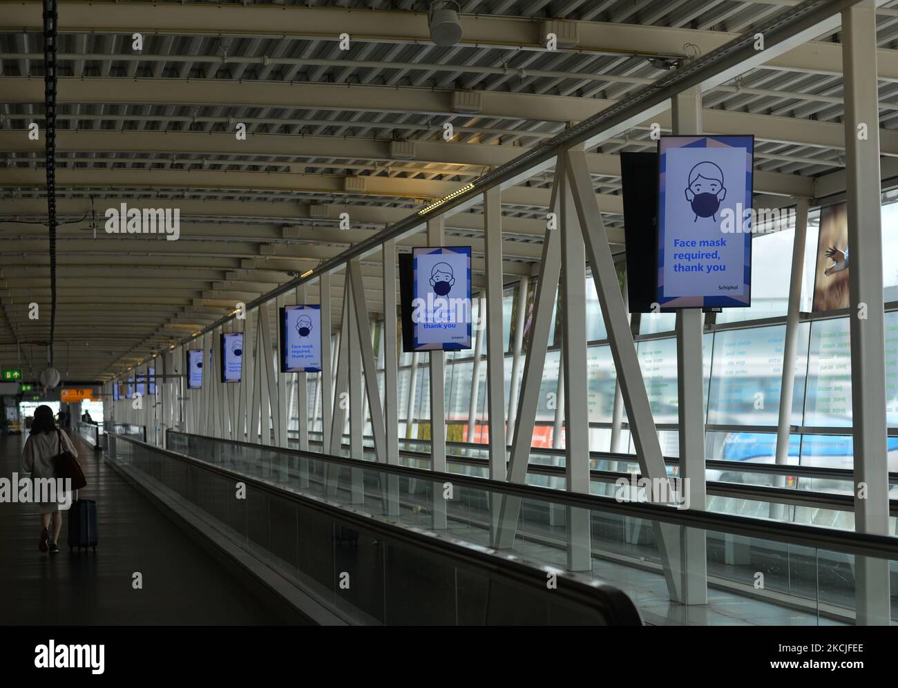 Face mask required signs at Amsterdam Airport Schiphol. On Friday ...