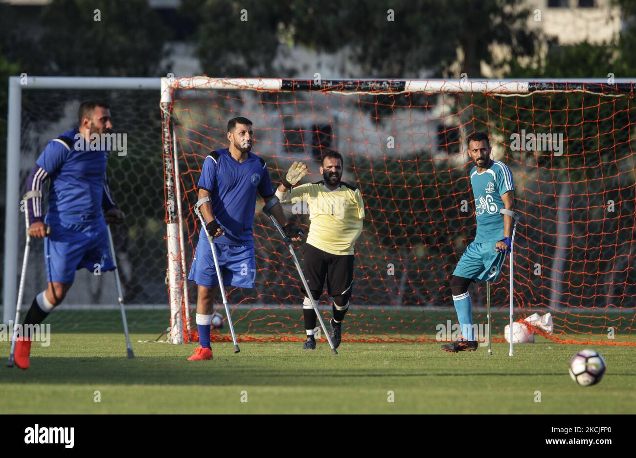 Palestinian amputee soccer players take part in a league match for ...