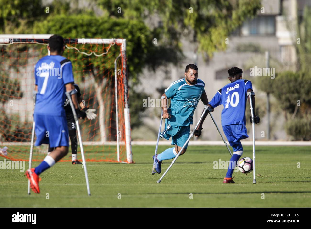 Palestinian amputee soccer players take part in a league match for ...