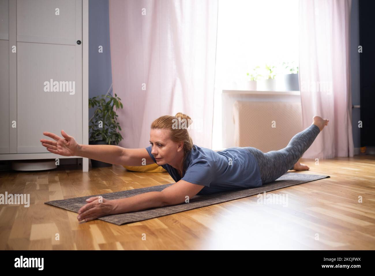 Woman doing navasana yoga hi-res stock photography and images - Alamy