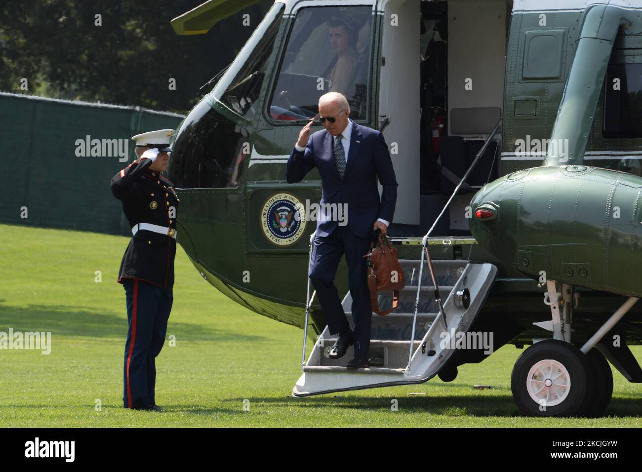 US President Joe Biden gets off the Marine One helicopter after ...