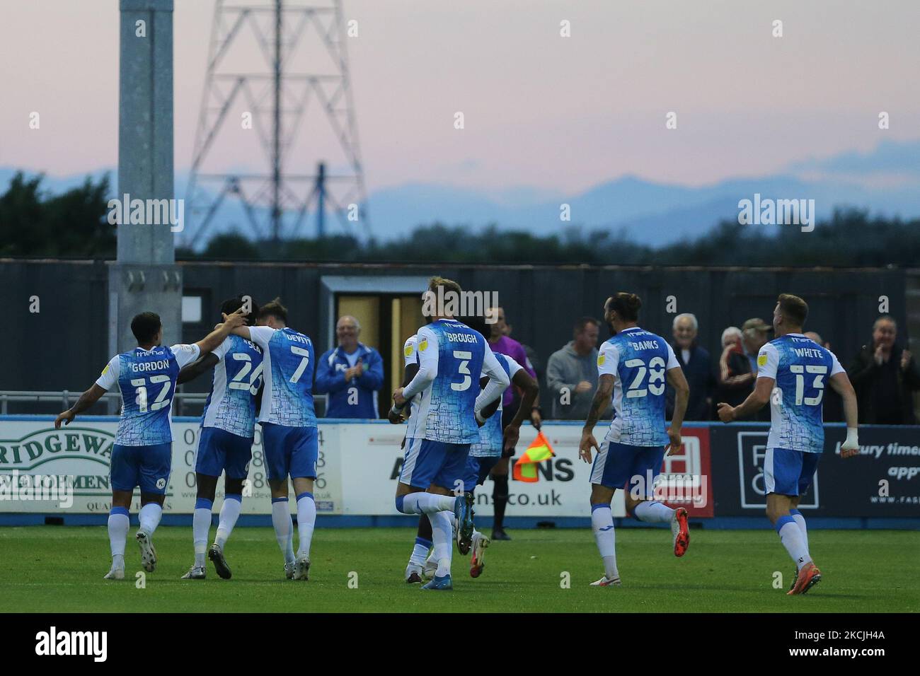 Barrow's Dimitri Sea celebrates with Jamie Devitt and Josh Gordon after ...