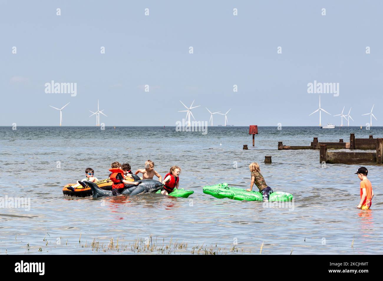 Holidaymakers enjoy sunny summer day at the beach in Whitstable, south ...