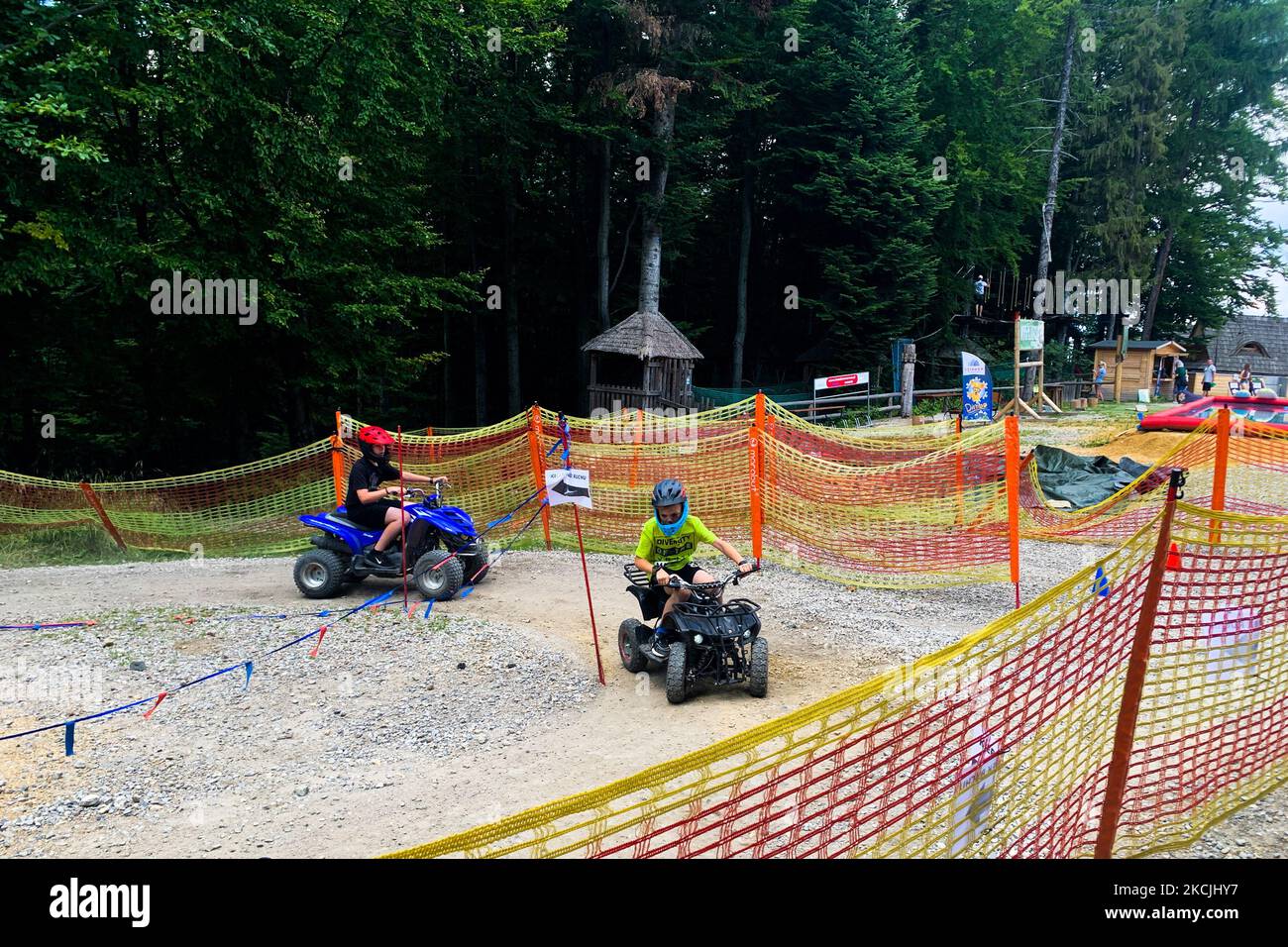 Kids ride a small quad bikes on a track in Kocierz, Poland on August 12 ...