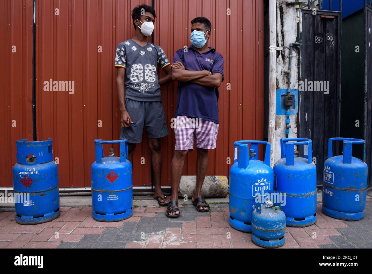 People stand in a queue waiting gas point near Colombo, Sri Lanka ...