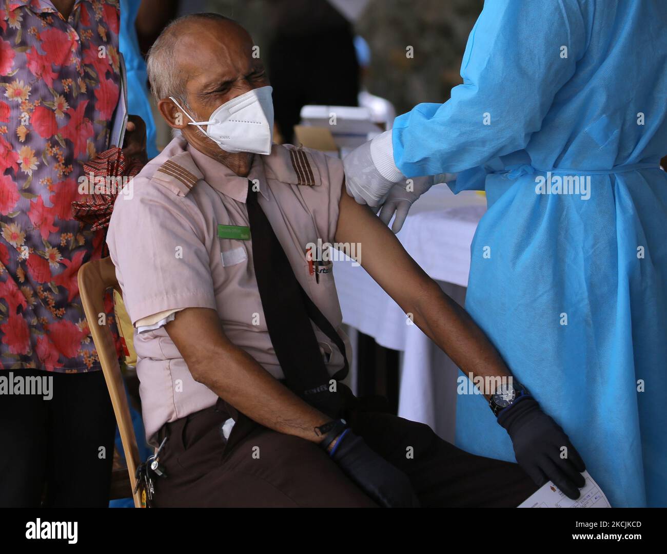 A Sri Lankan man reacts as he receives a jab of the Chinese-made Sinopharm vaccine at a ...