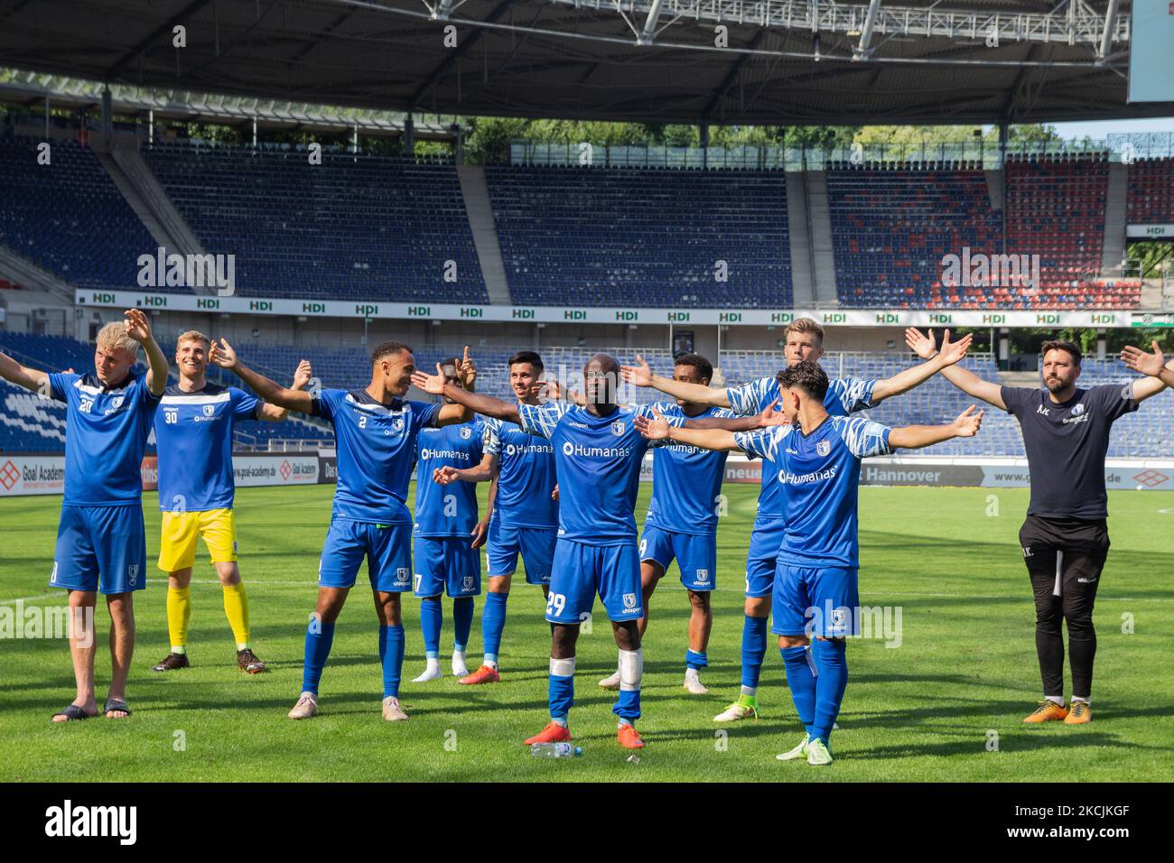 Players of 1. FC Magdeburg celebrate with fans following their victory ...