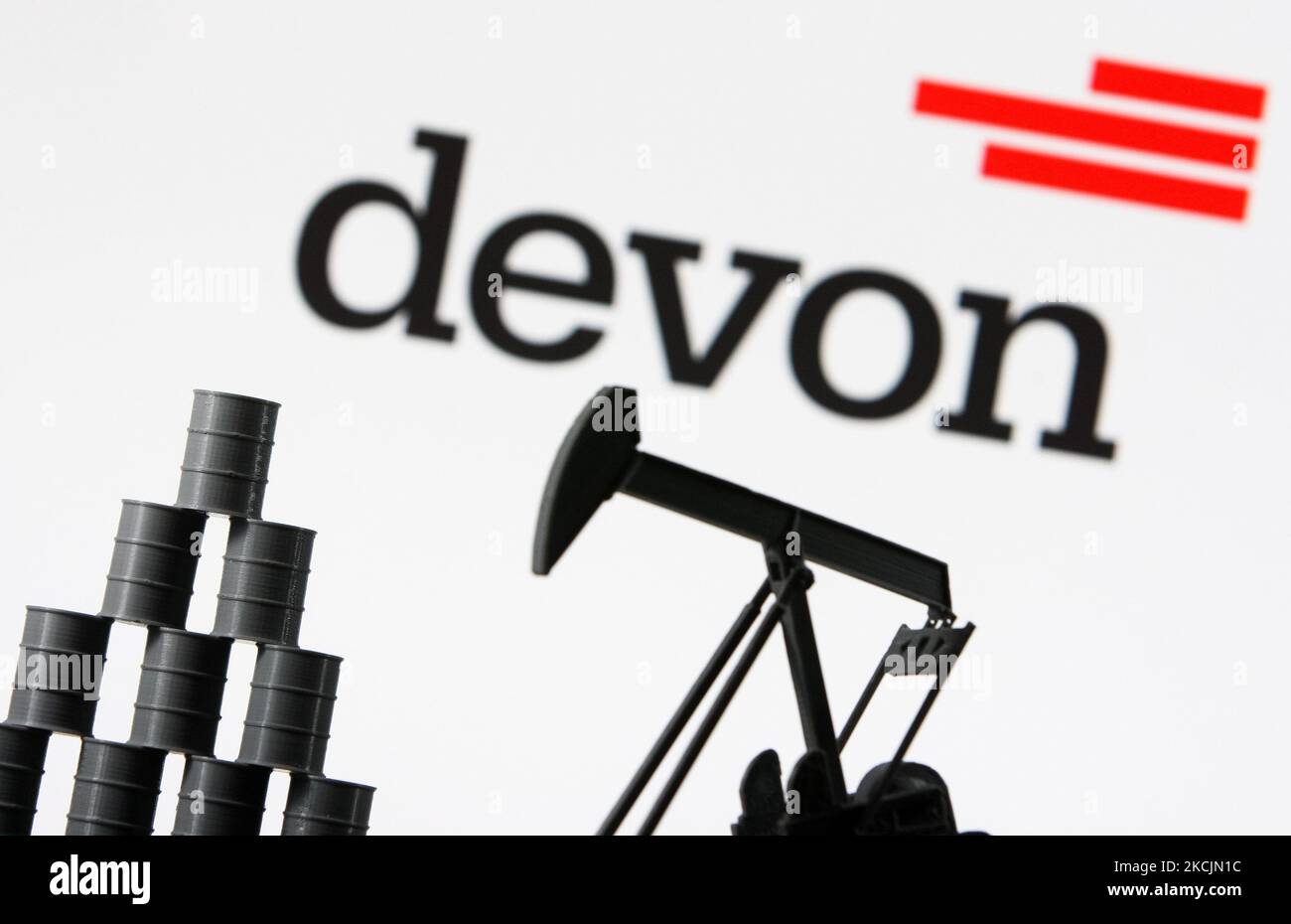Devon Energy Corporation company logo and miniature models of an oil ...