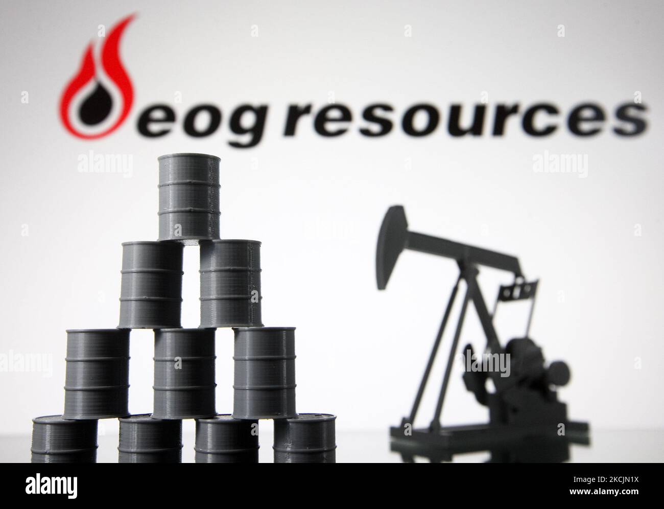 EOG Resources company logo and miniature models of an oil derrick pump ...