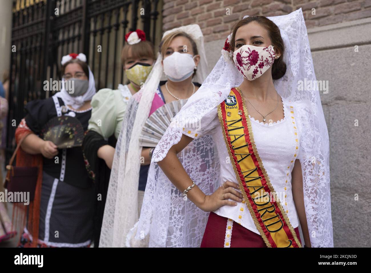 Women dressed in the typical costume of Chulapas attend a Eucharist on ...