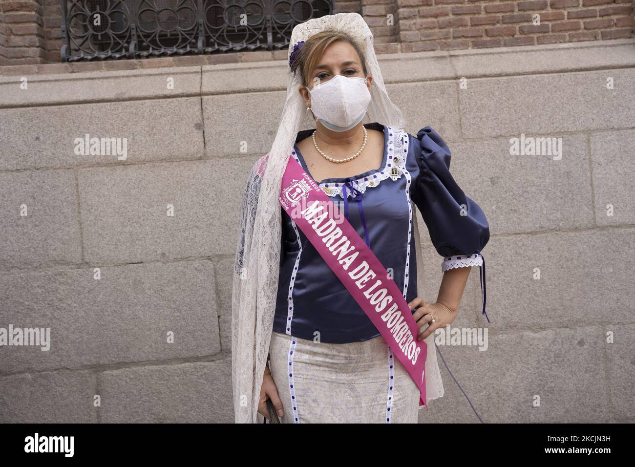 Women dressed in the typical costume of Chulapas attend a Eucharist on ...