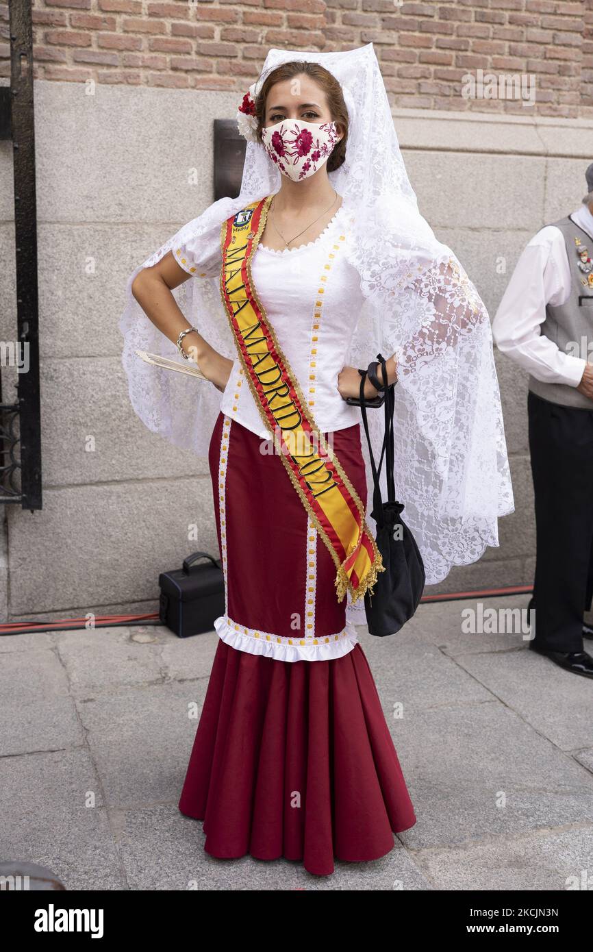 Women dressed in the typical costume of Chulapas attend a Eucharist on ...