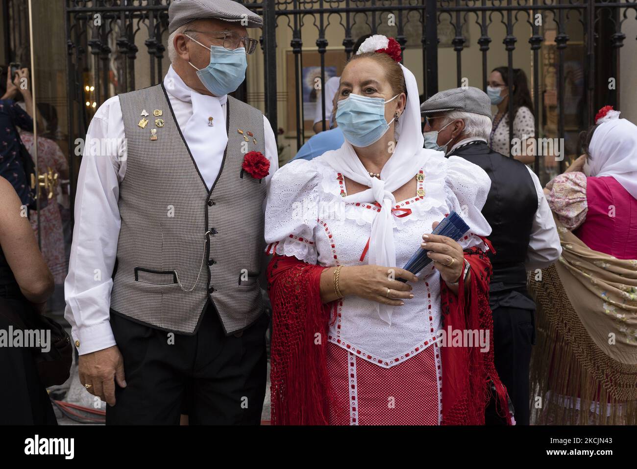 Women dressed in the typical costume of Chulapas attend a Eucharist on ...