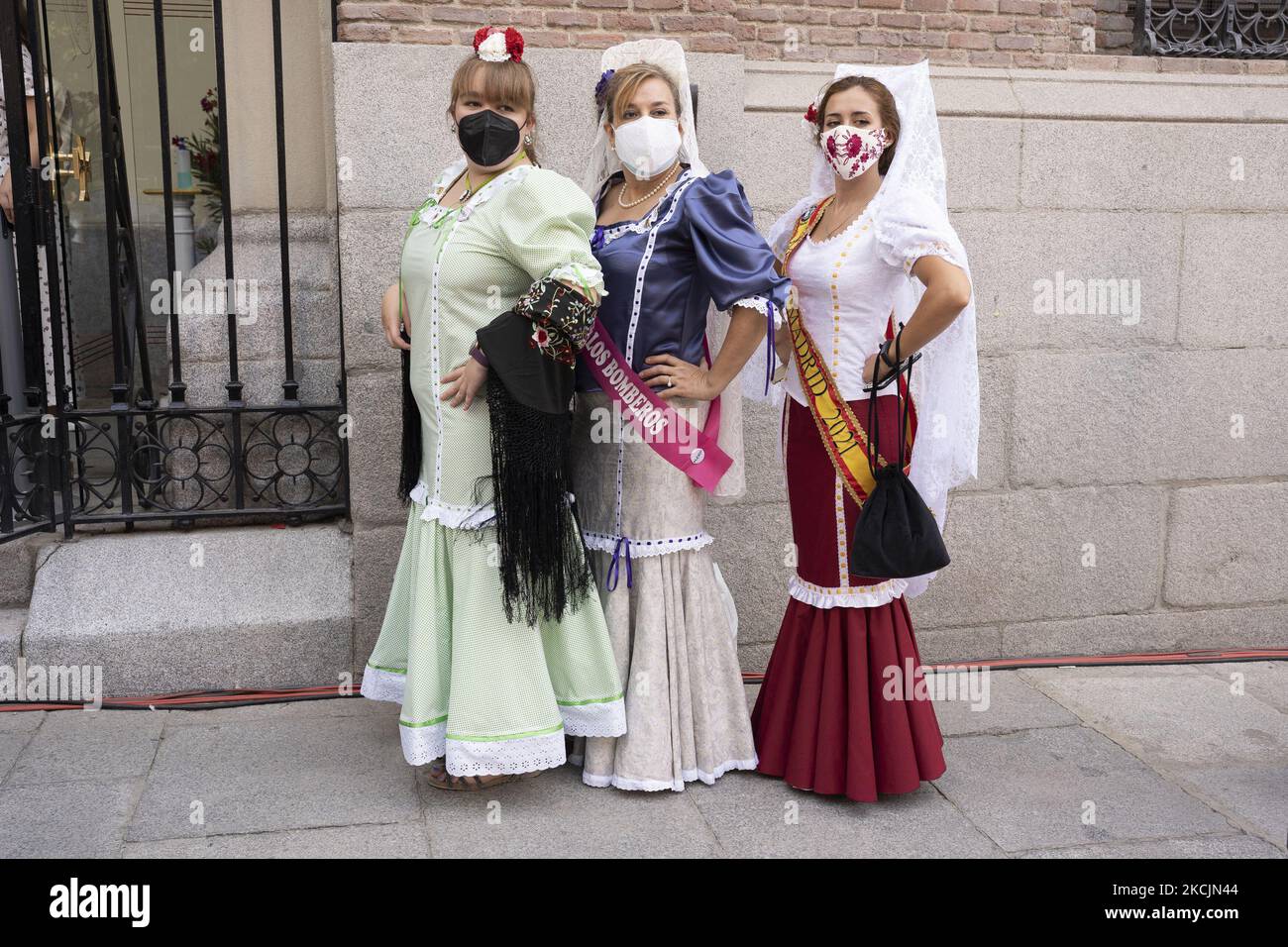 Women dressed in the typical costume of Chulapas attend a Eucharist on ...