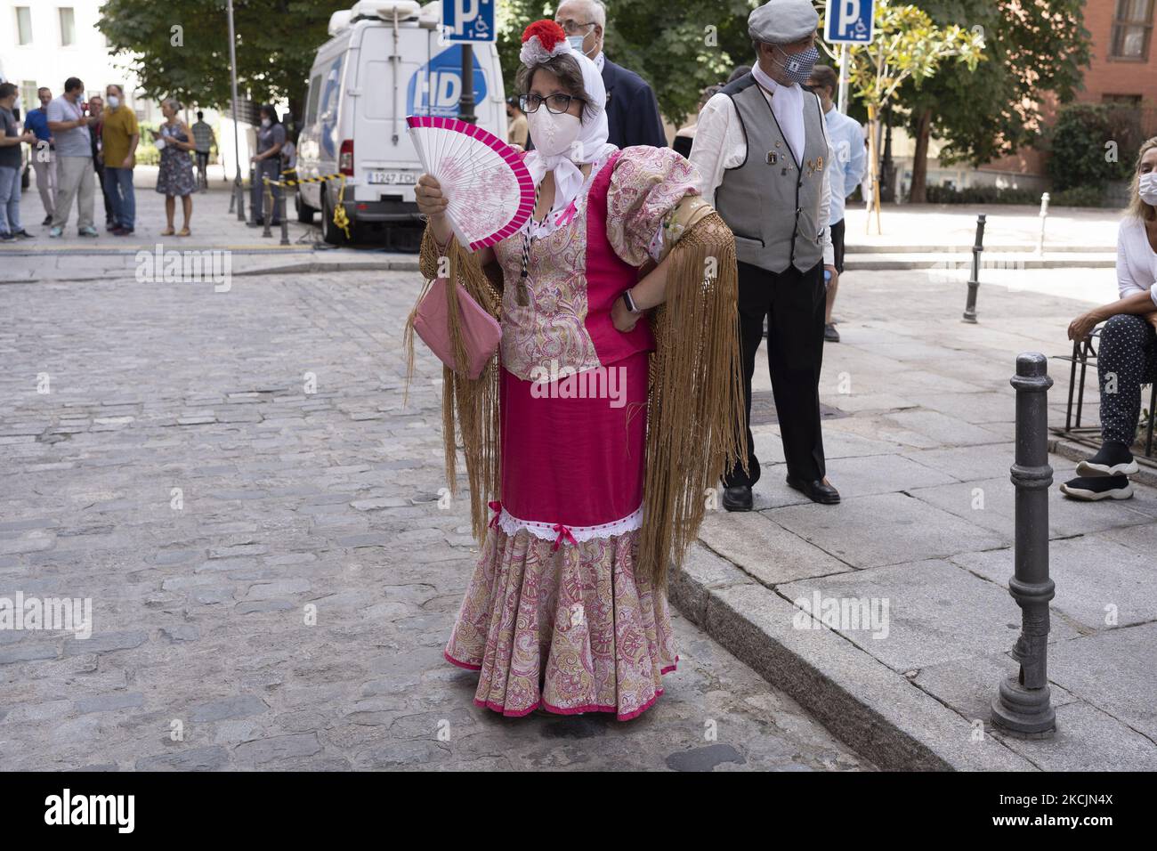 Women dressed in the typical costume of Chulapas attend a Eucharist on ...