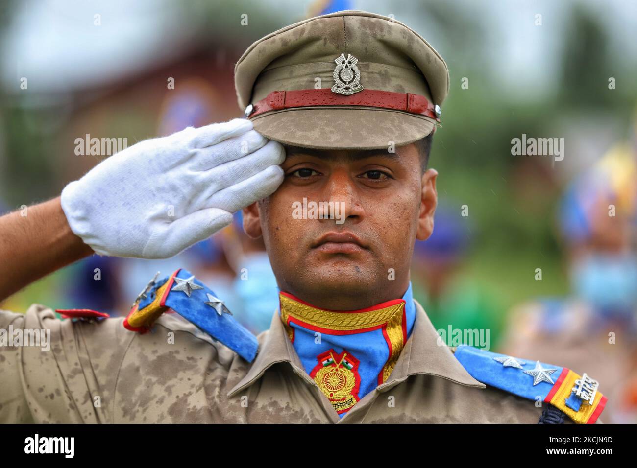 A Contigent of Indian Policemen stand in formation at Khushal Stadium ...