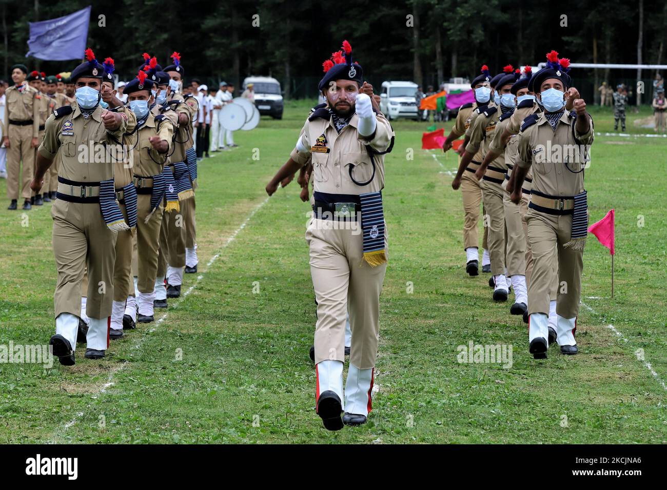 A Contigent of Indian Policemen stand in formation at Khushal Stadium ...