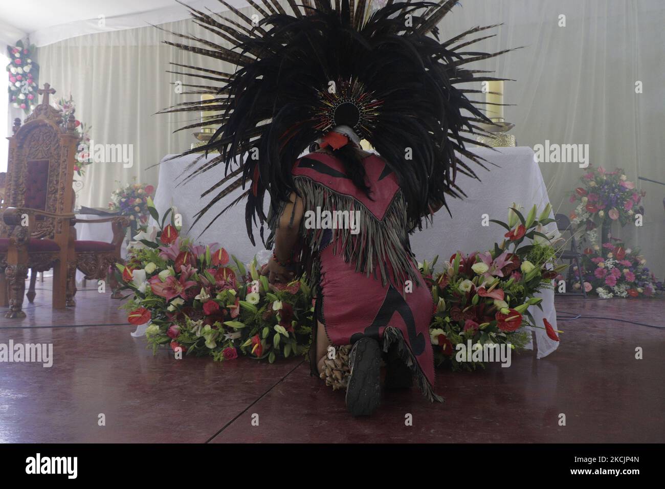 A pre-hispanic dancer performs a ritual with incense and copal on an ...