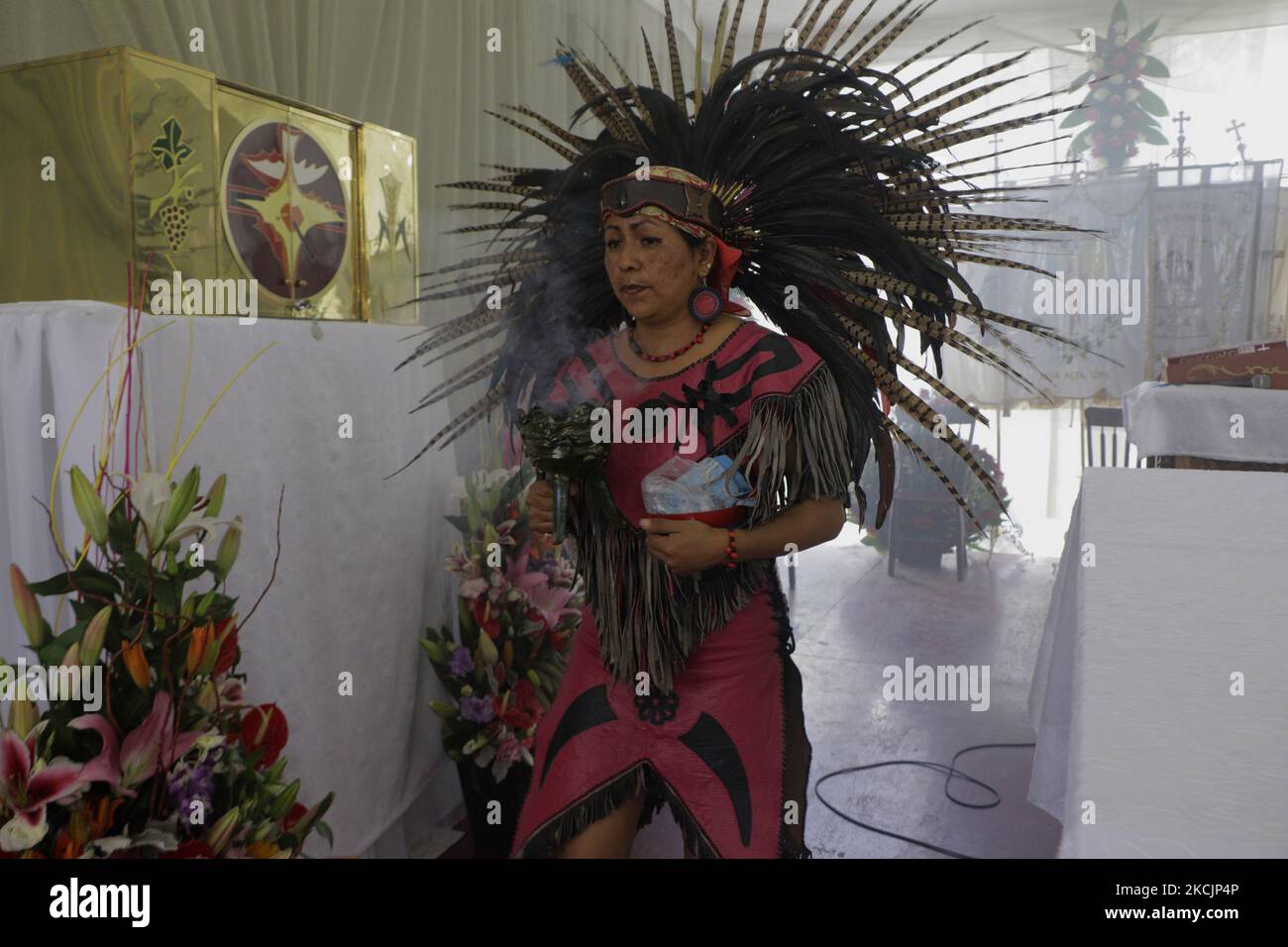 A pre-hispanic dancer performs a ritual with incense and copal on an ...