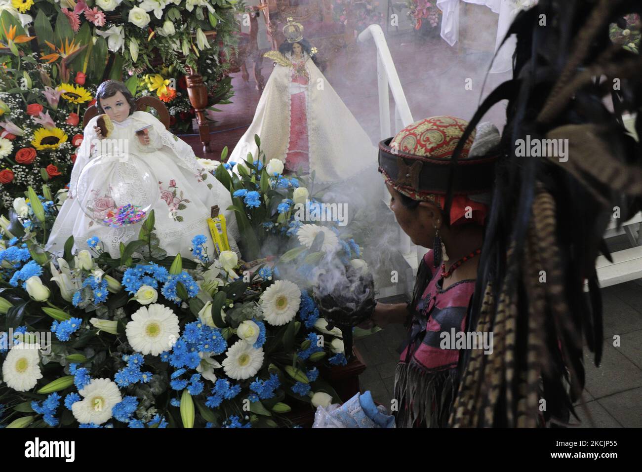 A pre-hispanic dancer performs a ritual with incense, copal and incense ...