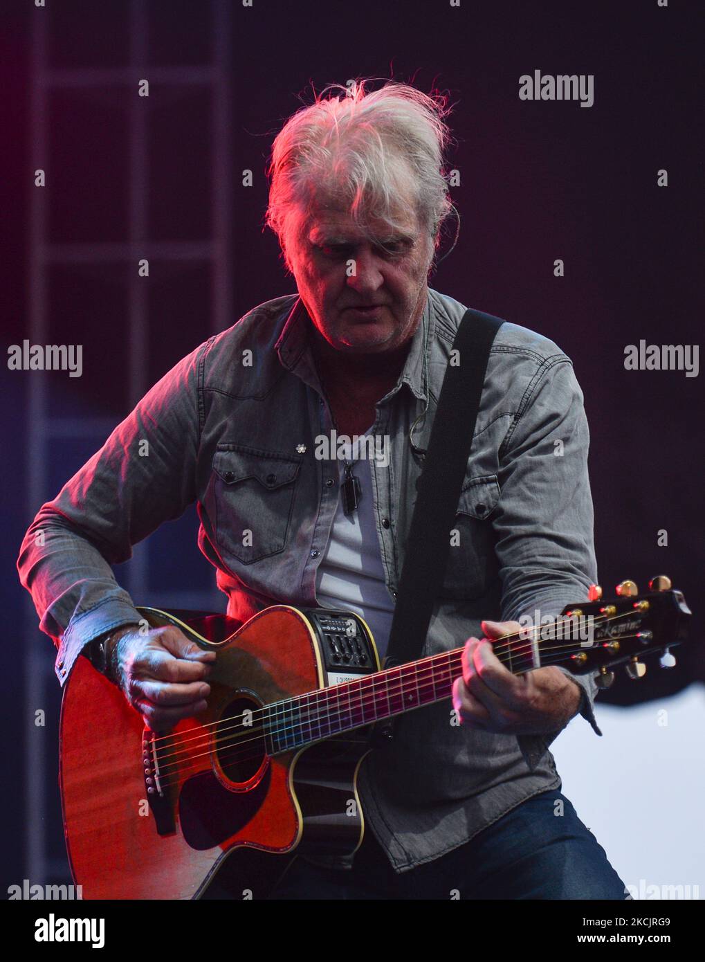 Canadian musician Tom Cochrane performs on stage during Edmonton Rock ...
