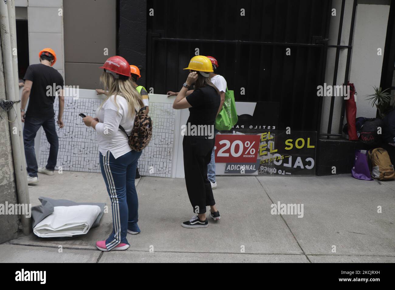eople enter the emergency area to recover their belongings where an ...