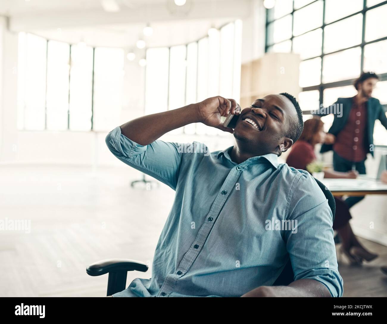 Stay in contact and keep your clients happy. a young businessman using ...