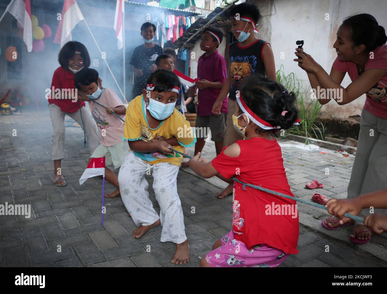 several children competing in the traditional child game (pull the roop ...