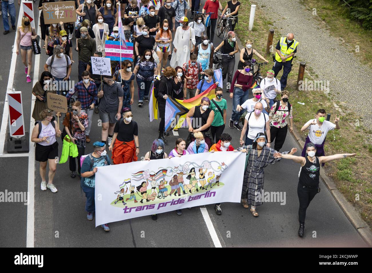 People attend the Trans Pride March in Berlin on July 10, 2021. (Photo ...